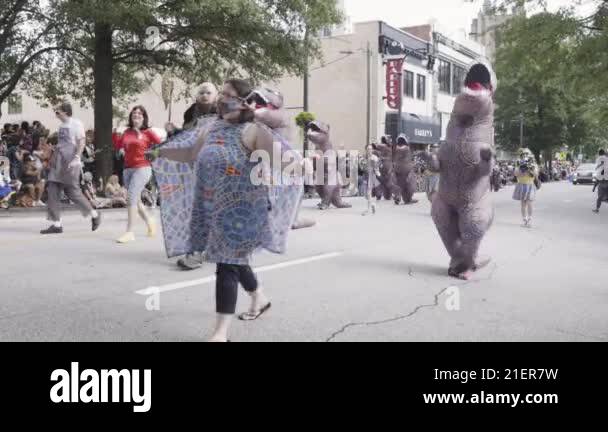 Atlanta, GA / USA September 2, 2023: People dressed in inflatable T-Rex ...