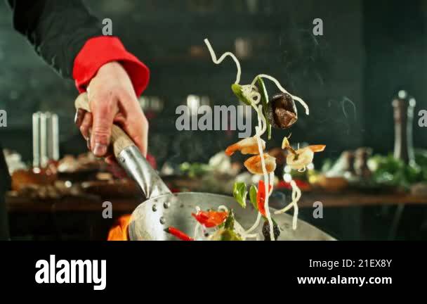 Super Slow Motion of Flying Asian Noodles with Vegetable and Prawns. Filmed on High Speed Cinema ...