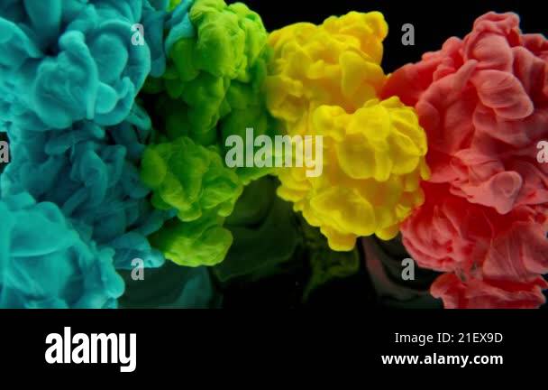 Super Slow Motion of Colored Paints Mixing in Water. Isolated on Black ...
