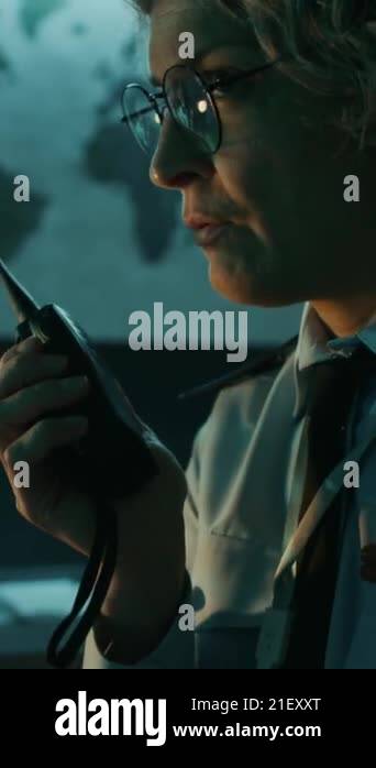 Vertical closeup of Caucasian female military or police officer in ...