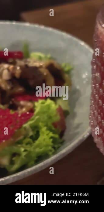 Raw beef dish garnished with parmesan cheese and leaves at a fine ...