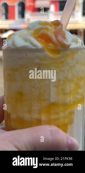 Person eating chia pudding with mango, yogurt and chia seeds. Creamy ...