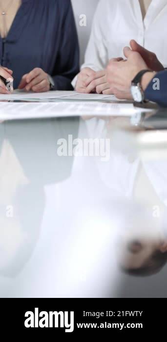 Business people or lawyers are reviewing contract terms during a ...