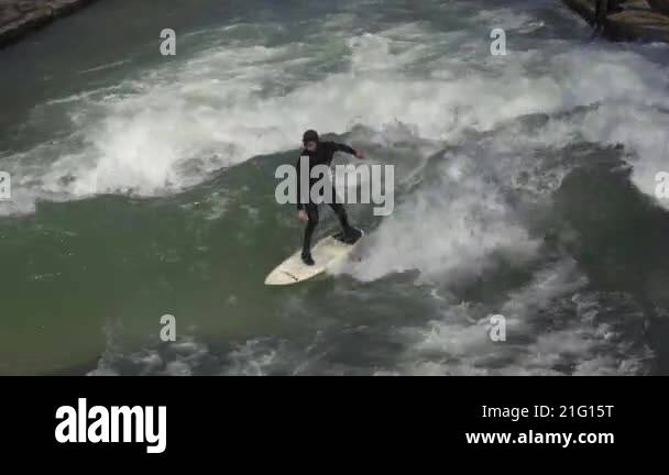 March 28, 2022. Munich, Germany. Eisbachwelle am Englischen Garten ...