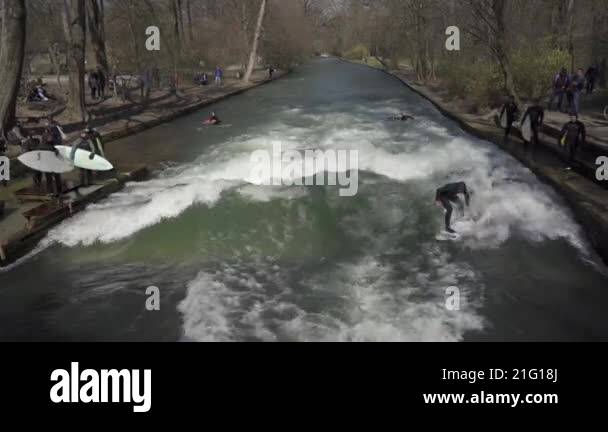 March 28, 2022. Munich, Germany. Eisbachwelle am Englischen Garten ...