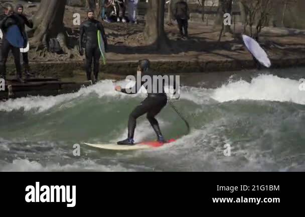 March 28, 2022. Munich, Germany. Eisbachwelle am Englischen Garten ...
