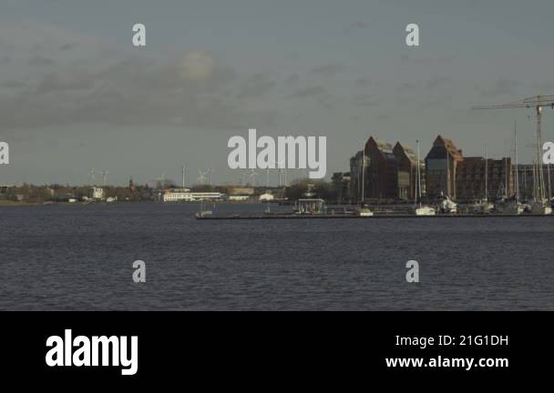 Rostock, Germany. Waterfront overlooking city and harbor on river ...