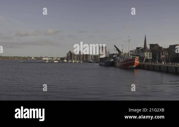 Rostock, Germany. Waterfront overlooking city and harbor on river ...