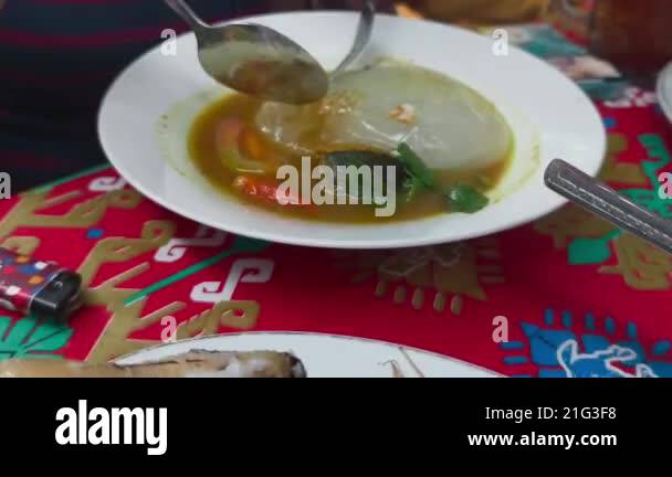 Papeda, a traditional Indonesian sago porridge served with a savory ...