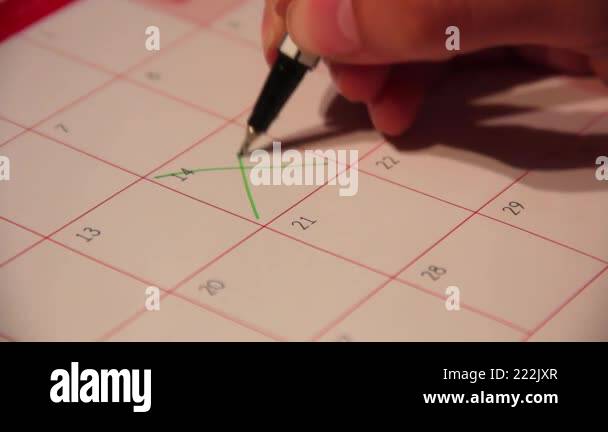 Hands Marking Dates on Calendar in Dark Room - Closeup - 4K Resolution ...