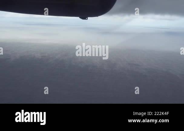View from the window of the seaplane to the ocean. The gradient of the ...