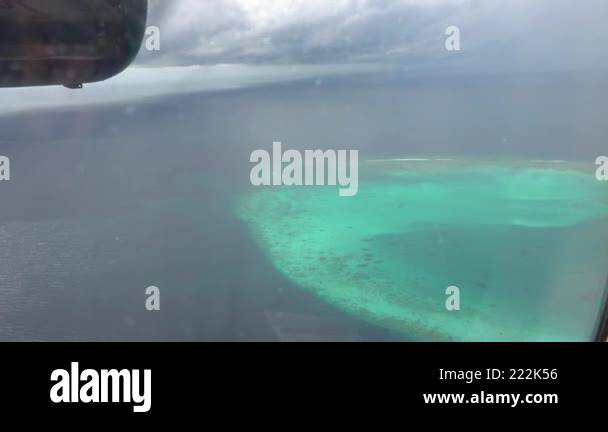 View from the window of the seaplane to the ocean. The gradient of the ...