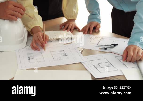 Smart architect and safety engineer discussion about building blueprint ...