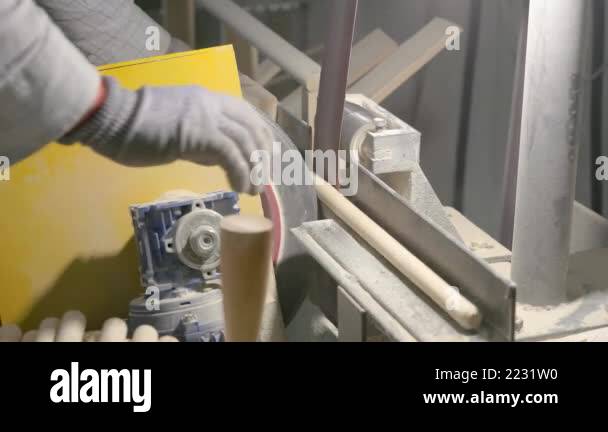 The video shows a woodworking process, where a spinning machine smooths ...