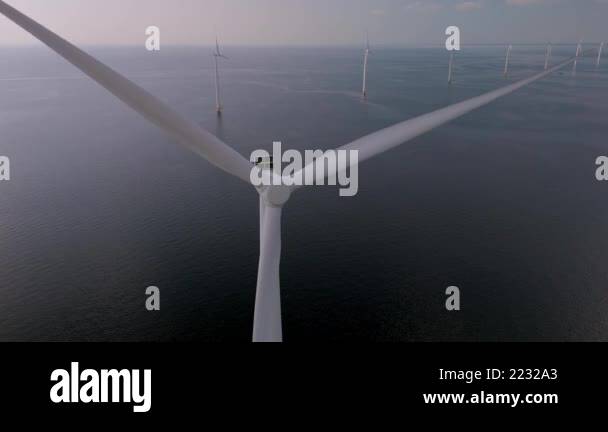 Majestic windmill turbines stand tall against the Dutch horizon ...
