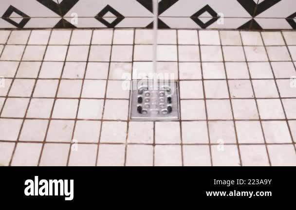 Somebody turns on the shower and the water starts to accumulate and ...