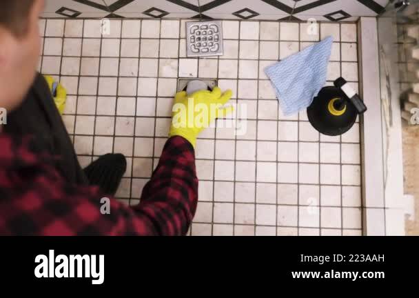 Drain in bathtub is completely clogged with human hair, it is ...