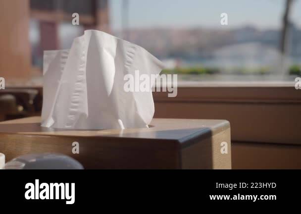 hand pull out a piece of tissue from tissue paper box Stock Video ...