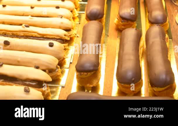 A visually enticing and tempting display of decadent chocolate eclairs ...