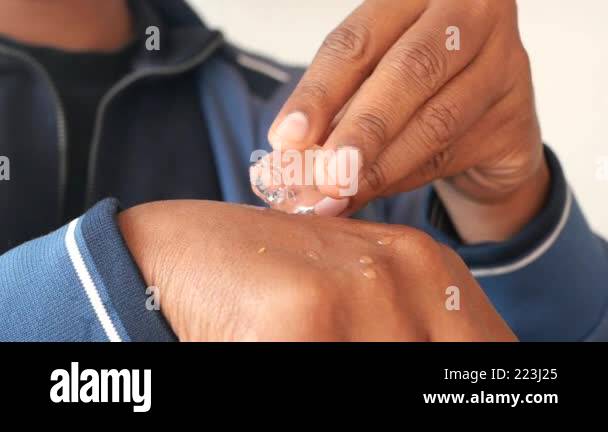 Man rubbing ice cube on his hand Stock Video Footage - Alamy