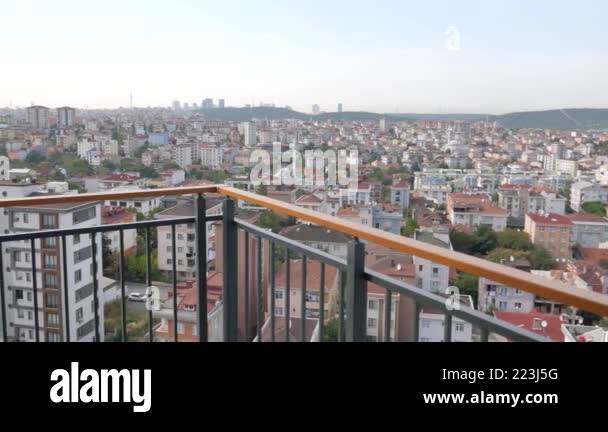 Enjoy a stunning city view from a stylish modern balcony that offers ...