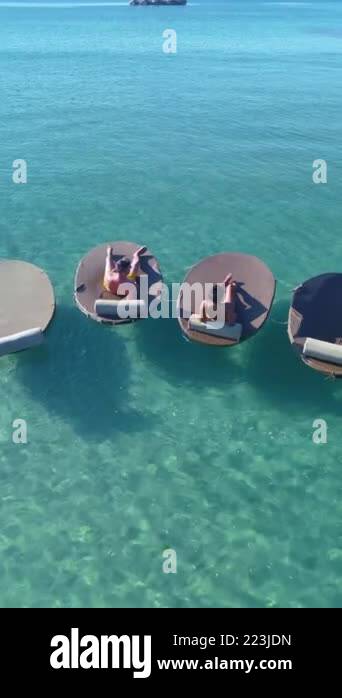 Experience a serene day at Koh Kood, Thailand as friends lounge on ...