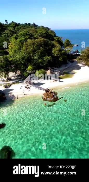 Experience the untouched beauty of Koh Munnork Island with its crystal-clear waters and soft ...