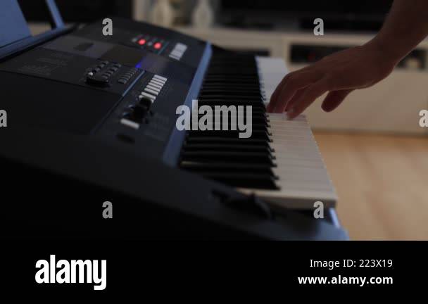 Musician hands glide effortlessly over a digital keyboard, showcasing ...