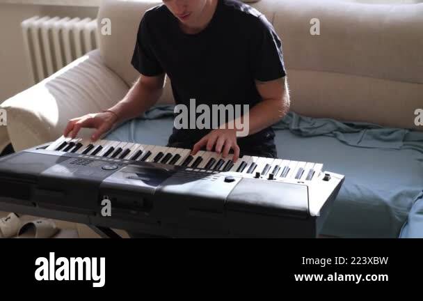 Musician hands glide effortlessly over a digital keyboard, showcasing ...