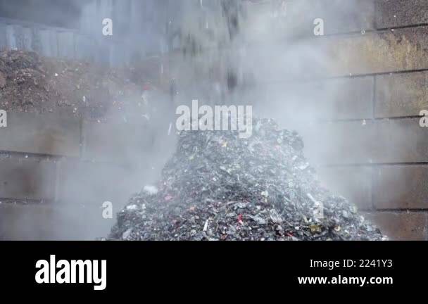 Sorting garbage at a landfill. Separating household waste from biowaste ...