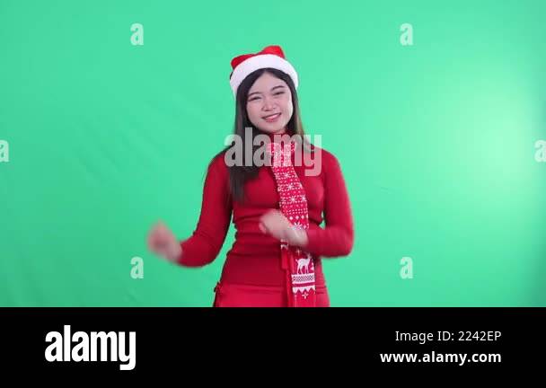 gesture of beautiful Asian woman celebrating Christmas with funny ...