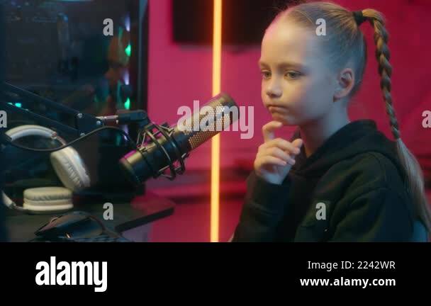 Pensive puzzled hesitate little Caucasian girl teenager gamer streamer ...