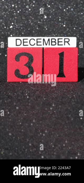 Portrait footage of red blocks with the Date December 31st which is New ...