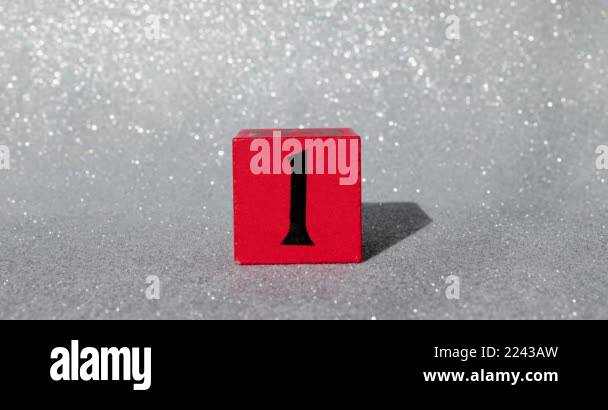 Footage of a red block with a silver glittery background showing the ...