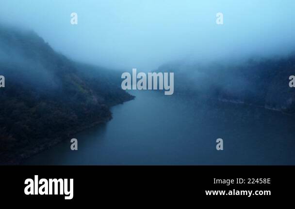 Aerial view of beautiful fog on the lake in the morning. Fresh early morning in the forest near ...