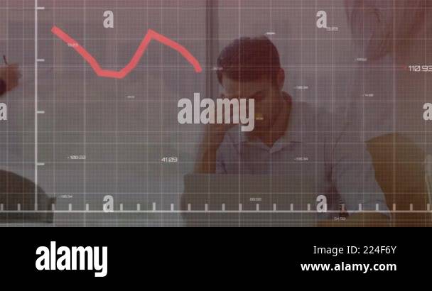 Stressed businesspeople in office with financial data and stock market ...