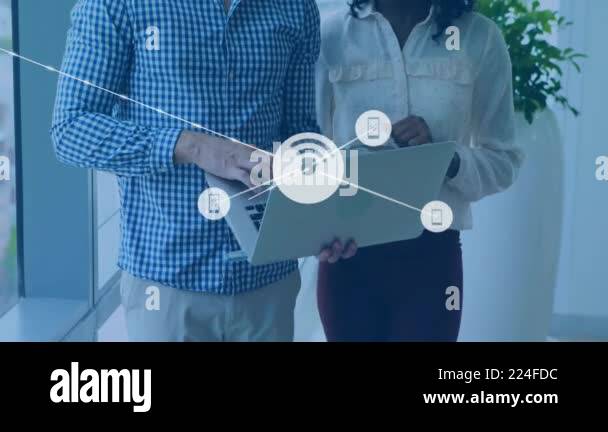 Using laptop, business people with network connections and data processing animation. Technology ...