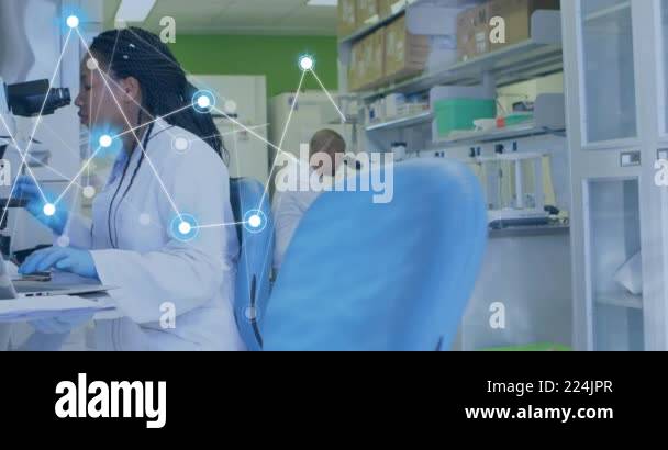 Animation of network of connections over african american female scientist working in lab ...