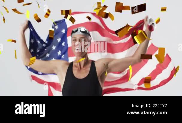 Animation of confetti over caucasian female swimmer holding flag of usa ...