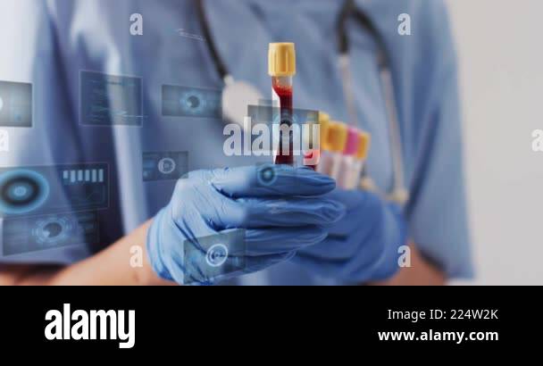 Holding blood samples, medical professional with data analysis ...