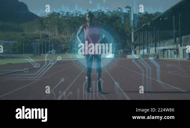 Digital interface animation over athlete standing on running track ...
