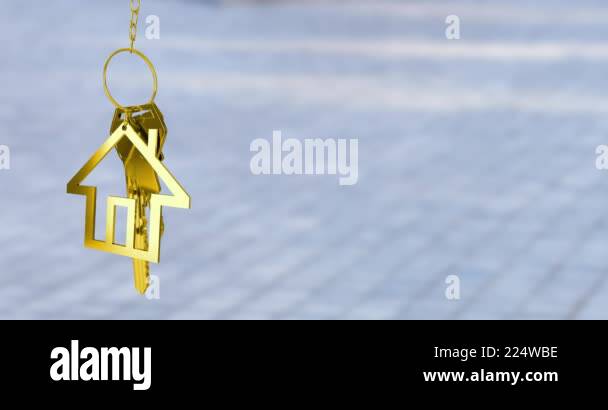 Golden house-shaped keychain animation over blurred background. luxury ...