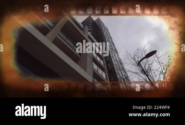 Film strip animation overlaying modern high-rise building and tree ...