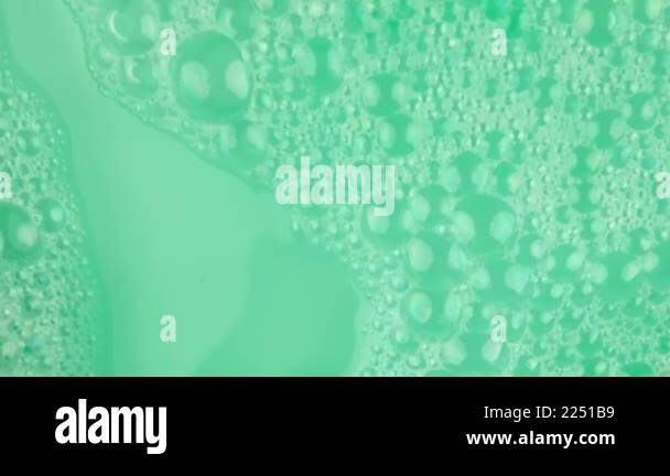 Transparent soap bubbles on green turquoise background. Soapy bubbles ...