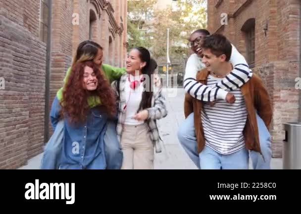 Diverse group of happy high school students posing outdoors, smiling ...
