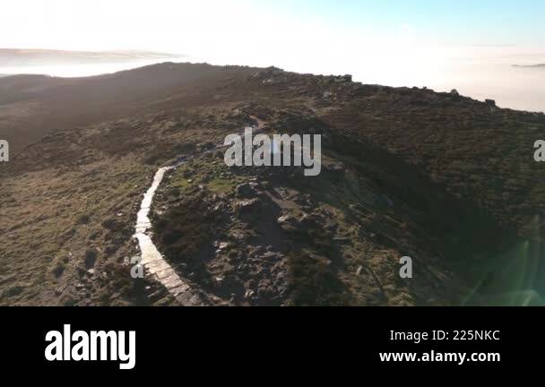Cinematic aerial drone orbit reveal shot from The Roaches trig point of ...