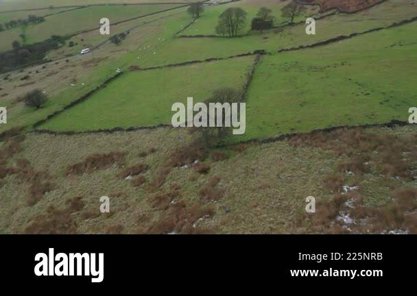 Cinematic aerial boomerang orbit reveal shot of a rugged winter ...