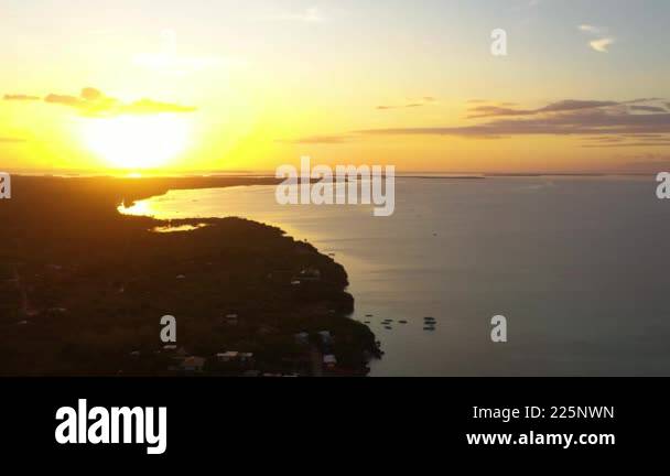 Aerial view of yellow sky over the tropical island. Sunset in Sunset in ...