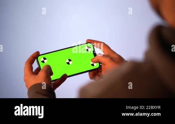 Horizontal smartphone in use for gaming or video Stock Video Footage ...