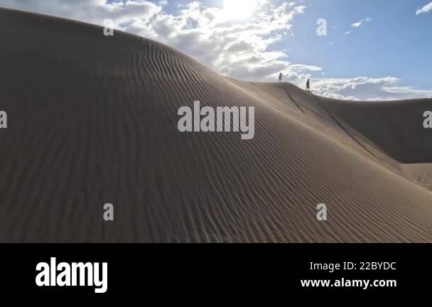 Witness the mesmerizing movement of sand as it flows gracefully in the ...